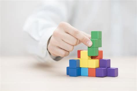 Man S Hand Stacking Colorful Wooden Blocks Stock Image Image Of Square Element 293729817