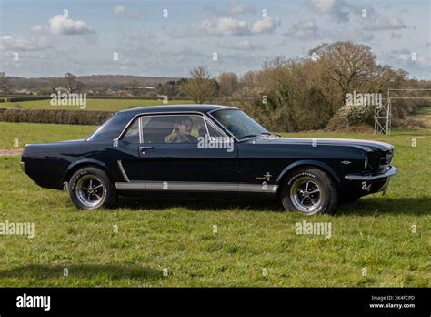 A Sideways View Of A 1965 47 Litre Ford Mustang Arriving To Be Parked
