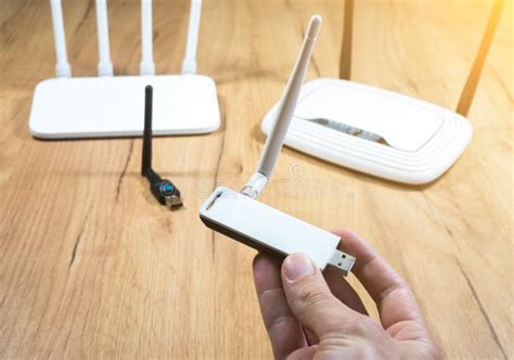 Man Choose Of Different Types Of Wi Fi Routers Modern And Old Technology Wireless Ethernet