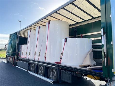 Premium Photo Loading Transporting And Unloading Large Rolls Of Paper In A Semitrailer Premium Photo Loading Transporting And Unloading Large Rolls Of Paper In A Semitrailer