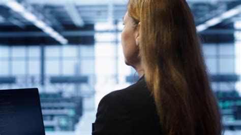 Technician Doing Checkup Inputting Data On Laptop Of Needed Server Hub Fixes Close Up Of