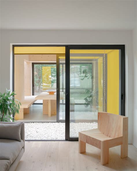 Unknown Works Finishes Clt House Extension With Bright Yellow Render