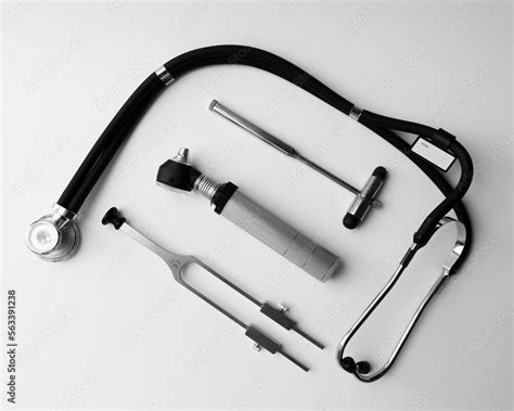 Tuning Fork C 128 On A White Background With Gradation Otorhinoscope Neurological Hammer And