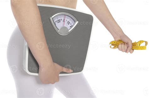 Female Model Holding Scale And Measuring Tape Over White Background 15986711 Stock Photo At Vecteezy