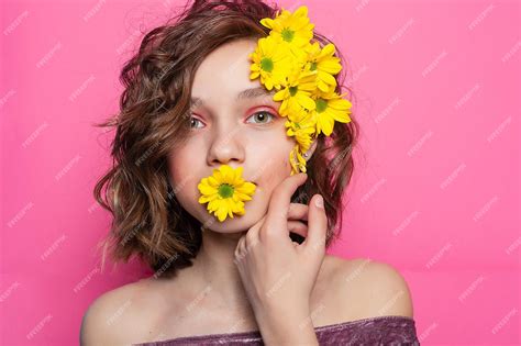 Premium Photo A Beautiful Young Girl On A Pink Background