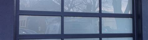 Oversized Aluminum Frosted Glass Garage Door In Custom Home In Oakville