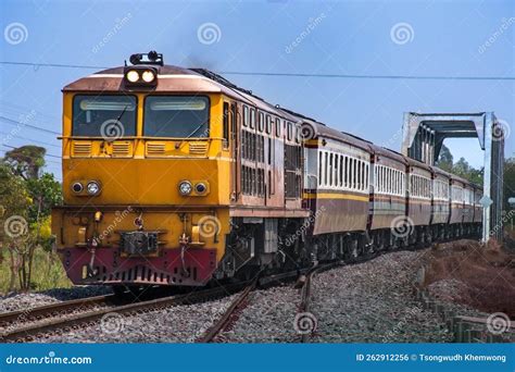 Passenger Train By Diesel Locomotive Passed The Railway Bridge Stock