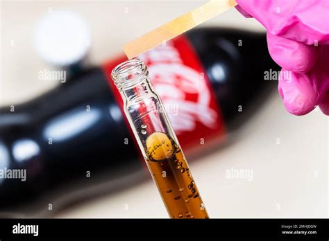 Moscow Russia January 12 2023 Measuring Of PH Level Of Coca Cola Classic Pink Litmus