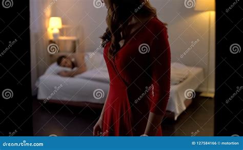 Offended Woman Leaving Hotel Room Man Sleeping In Bed Adultery And
