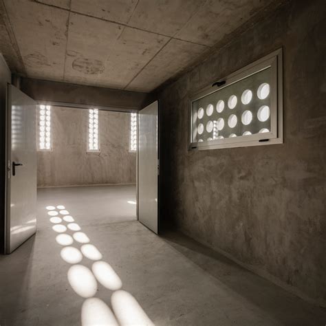 Circular Perforations Create Spotlights In Granada School