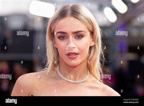 Jess Qualter Poses For Photographers Upon Arrival For The Premiere Of