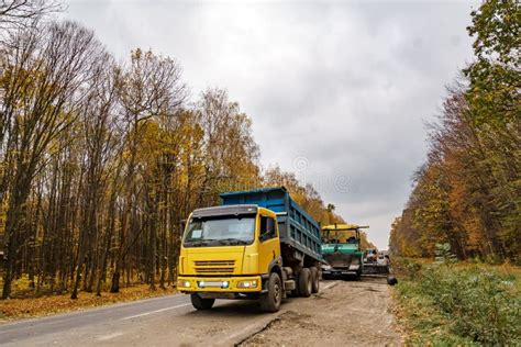 Road Repair Laying New Asphalt Heavy Special Machines Truck In Operation Side View Closeup