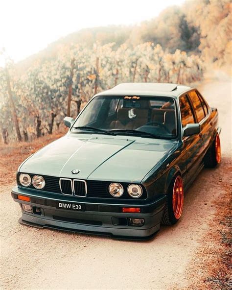A Car Parked On The Side Of A Dirt Road