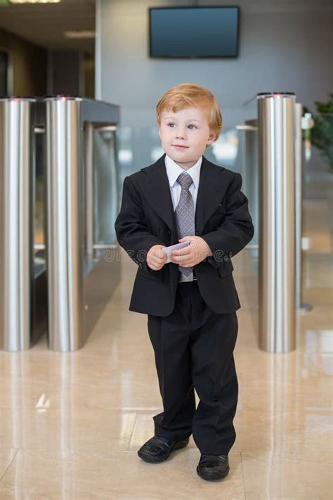 A Boy In A Suit At The Entrance To The Business Stock Image Image Of