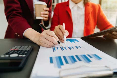 Premium Photo Businessman And Team Analyzing Financial Statement Premium Photo Businessman And Team Analyzing Financial Statement
