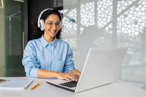 Young Beautiful Latin American Programmer Working Inside Office With
