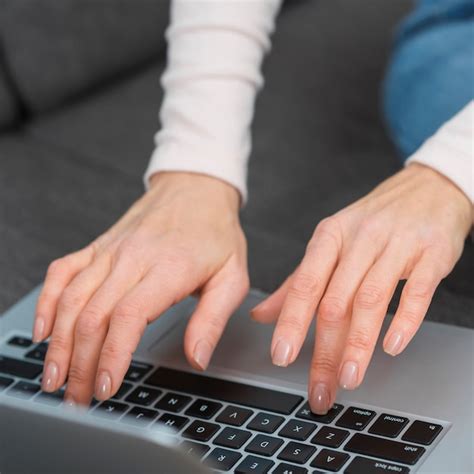 Free Photo Close Up Of Woman S Hand Typing On Laptop
