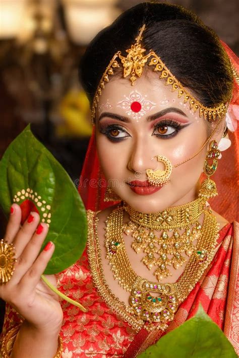 Portrait Of Very Beautiful Young Indian Bride In Luxurious Bridal