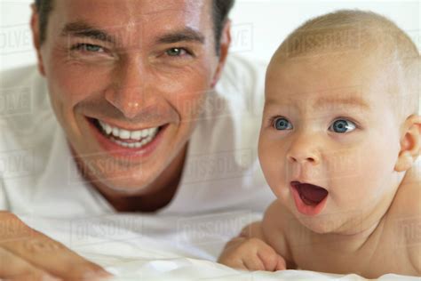 Father And Baby Laughing Together Portrait Stock Photo Dissolve