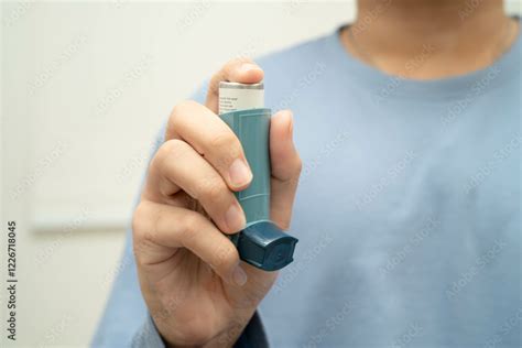 Asthma And Chronic Obstructive Pulmonary Disease Copd Asian Young Man Using Metered Dose