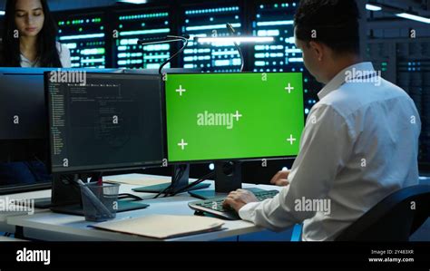technician using mockup computer in data center managing servers