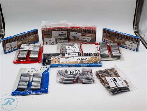 11 Assorted Kirkland Signature Batteries New Some Missing Roller