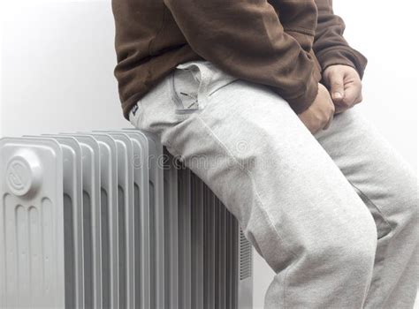 The Freezing Man Sitting And Heating His On Oil Heater Stock Photo Image Of House Senior