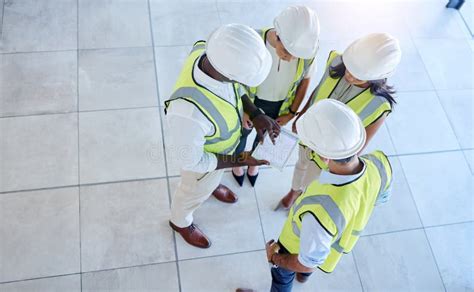 Architecture Engineering And Design Team Use Tablet For Planning Building Construction On