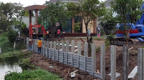 งานเสียบแผ่น กำแพงกันดิน ที่ความสูง 2 เมตร ยาว 40 เมตร Youtube