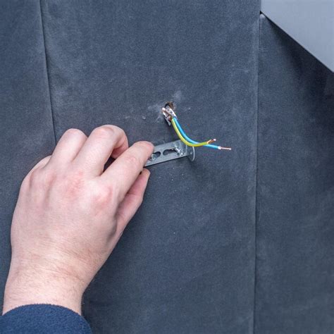 Premium Photo Installation Of A Lamp In The Bed Area Electricity