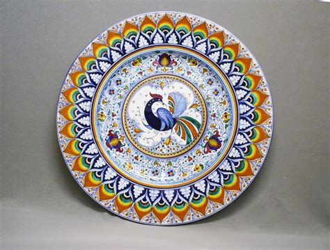Ornamental Ceramic Wall Plate Decorated By Hand With Peacock Feathers