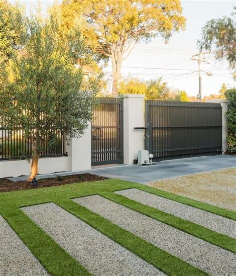 Modern Front Yard Landscaping With Artificial Grass And Exposed Aggregate Concrete