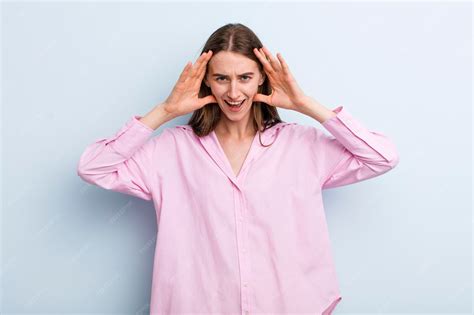 Premium Photo Screaming In Panic Or Anger Shocked Terrified Or Furious With Hands Next To Head