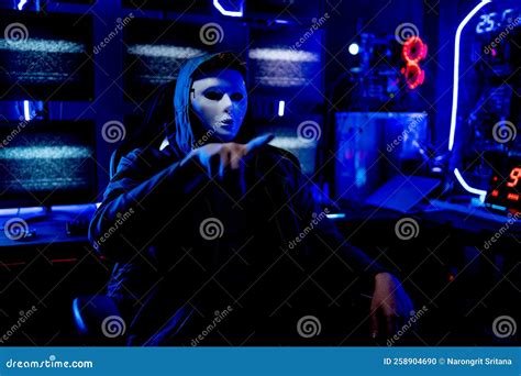 Man Wear White Mask Look Like Hacker And Point To Front In Room And