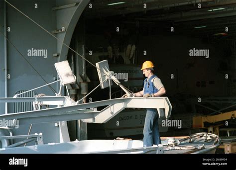 An Upper Cradle Attachment Is Lifted Away From A Utility Boat On An Elevator Aboard The Nuclear