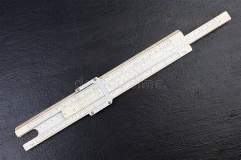 Logarithmic Ruler On Black Background Stationery For Engineers And