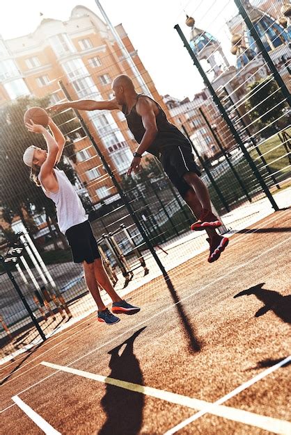 Premium Photo Playing Hard Two Young Men In Sports Clothing Playing