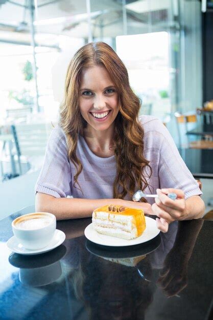 Premium Photo Pretty Brunette Enjoying A Cake