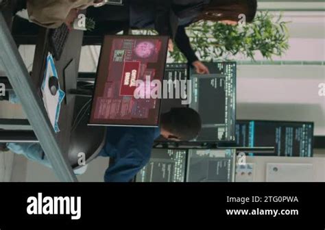 Vertical Video Diverse Group Of App Developers Working With Hacked