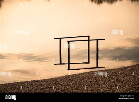 Steel Structures Standing In The Shallow Water Reflected In The