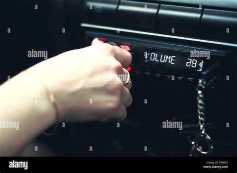 A Female Hand Pushing The Power Button To Turn On The Car Stereo System Stock Photo Alamy