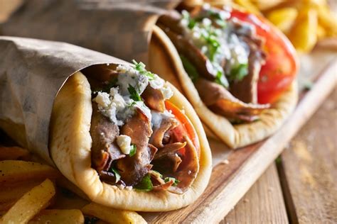 Premium Photo Two Lamb Gyros With Feta Cheese And Tzatziki Sauce