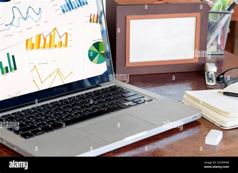Computer Laptop And Graph Stock Photo Alamy