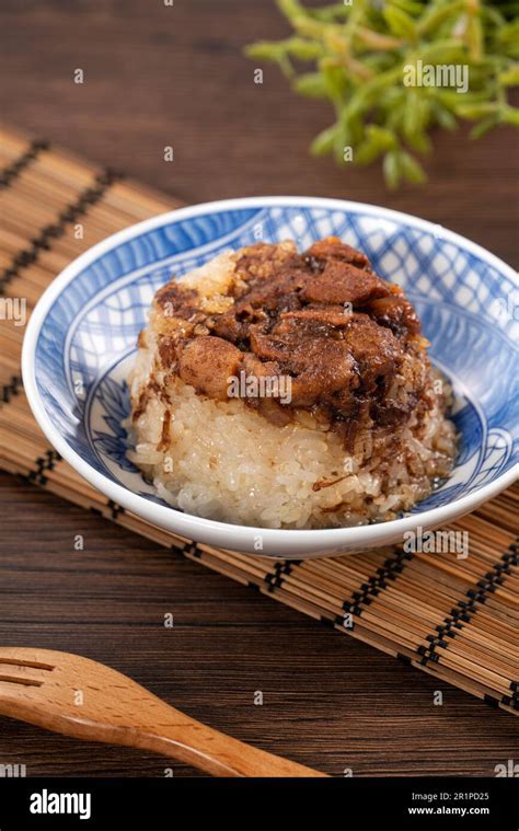 Migao Tube Rice Cake Rice Pudding In A Bowl Topped With Minced Pork