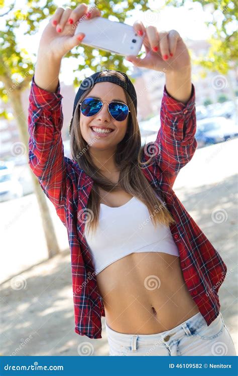 Portrait Of Beautiful Girl Taking A Selfie With Mobile Phone Stock