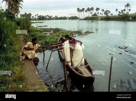 A Woman Helping Another Woman To Get Down From The Boat Backwaters Of