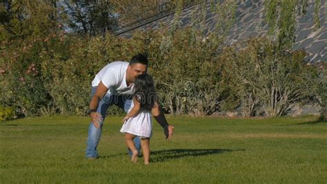 Girl Runs To Dad Greeting Her With Open Arms Stock Footage Video Of