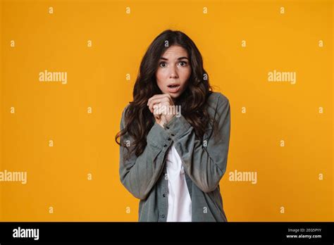 Shocked Beautiful Girl Expressing Surprise On Camera Isolated Over