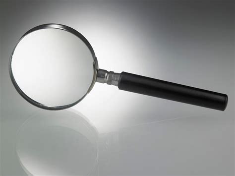 Premium Photo Close Up Of Magnifying Glass On Gray Background