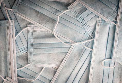 Premium Photo Closeup Disposable Medical Masks In The Stack Detailed
